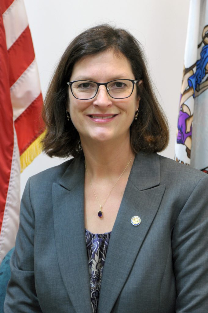 Portrait with flags - Virginia Department of Forensic Science